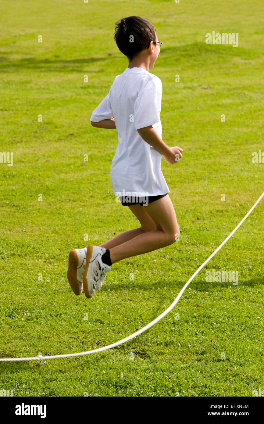 Child when jumping rope Stock Photo - Alamy