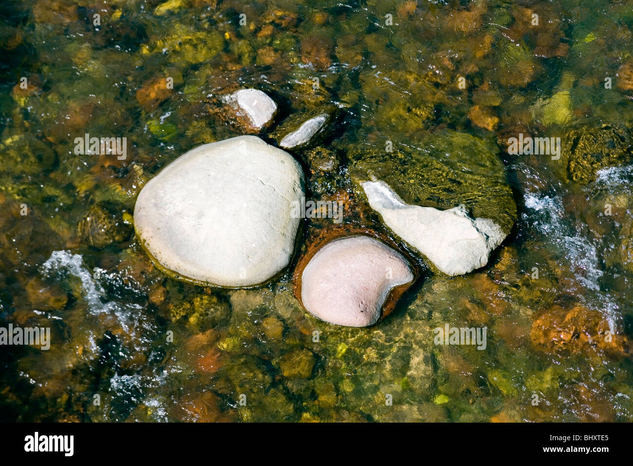 Stones in a river Stock Photo - Alamy