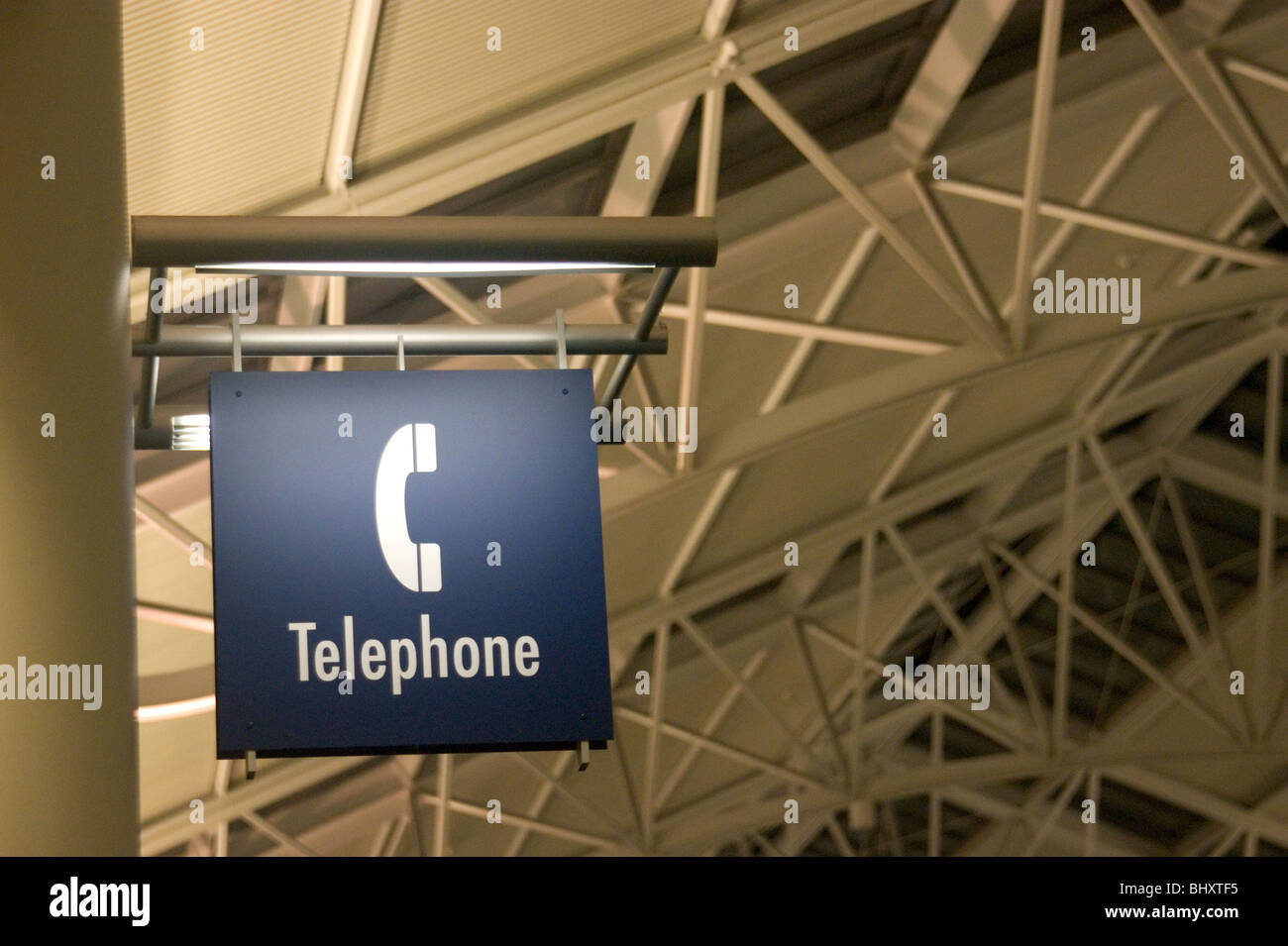 Hanging blue sign Stock Photo - Alamy