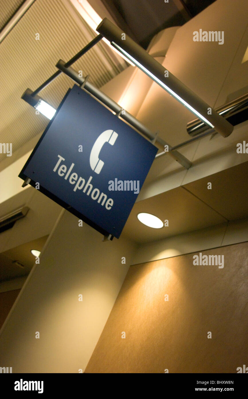 Hanging blue sign Stock Photo - Alamy