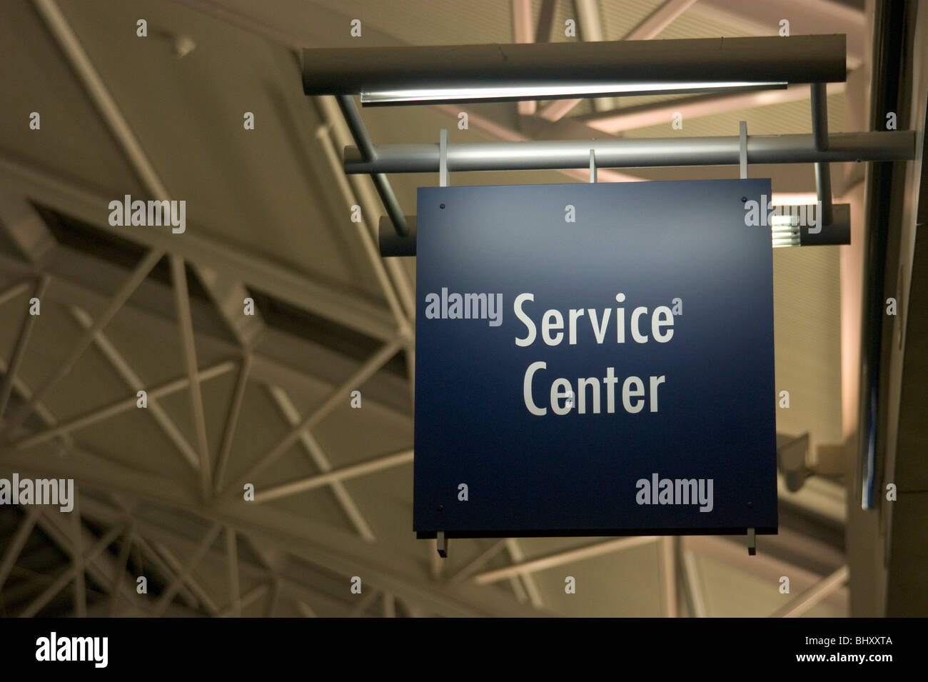 Hanging blue sign Stock Photo - Alamy