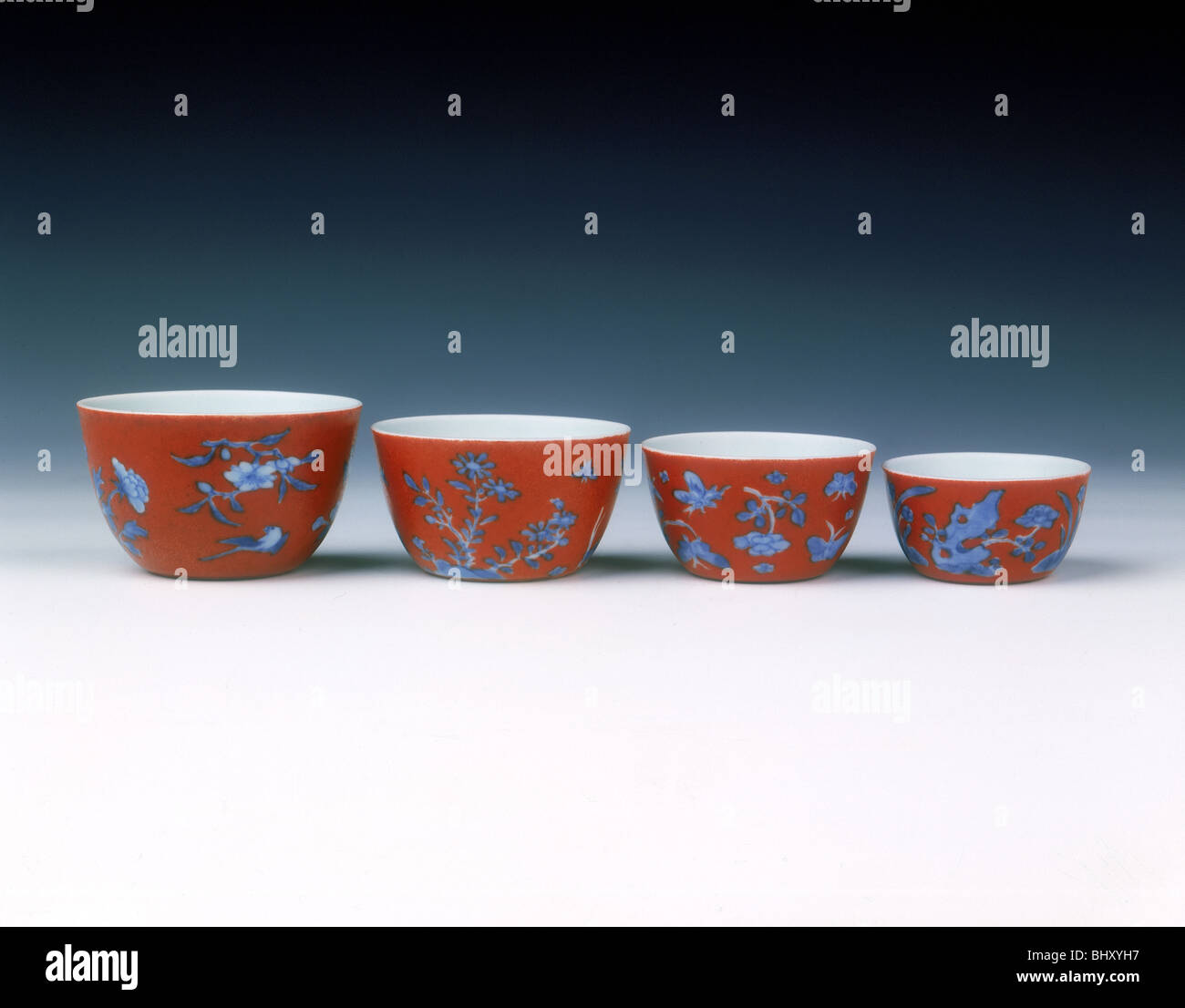 Set of four graduated wine cups on coral ground, Qing dynasty, China ...
