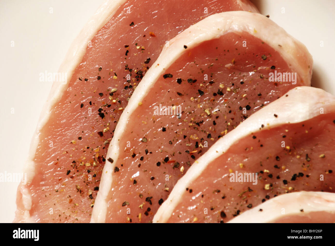 Peppered pig steaks Stock Photo - Alamy