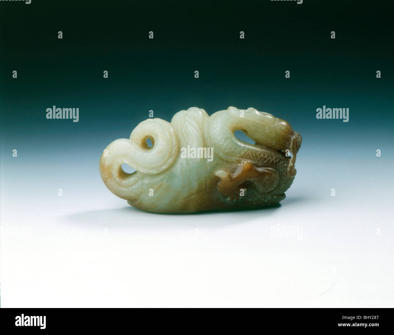 Jade five-clawed dragon with feathered tail in cloth wrapping, late ...