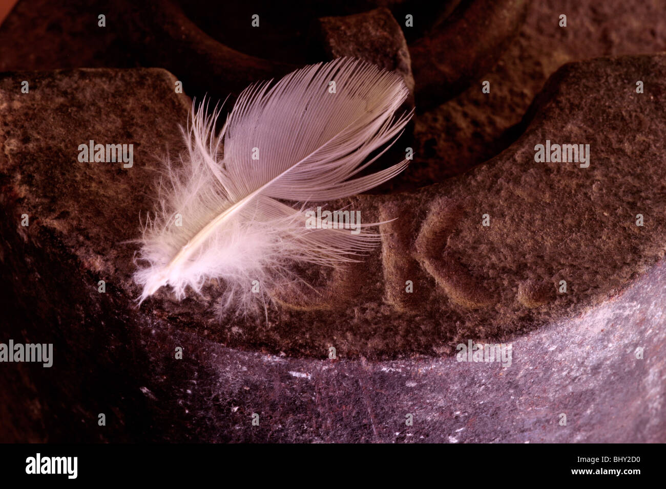 Feather/spring on a weight Stock Photo - Alamy