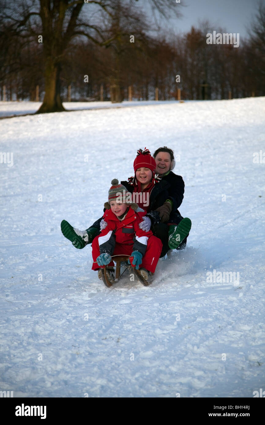 Children playing on a sled hi-res stock photography and images - Alamy