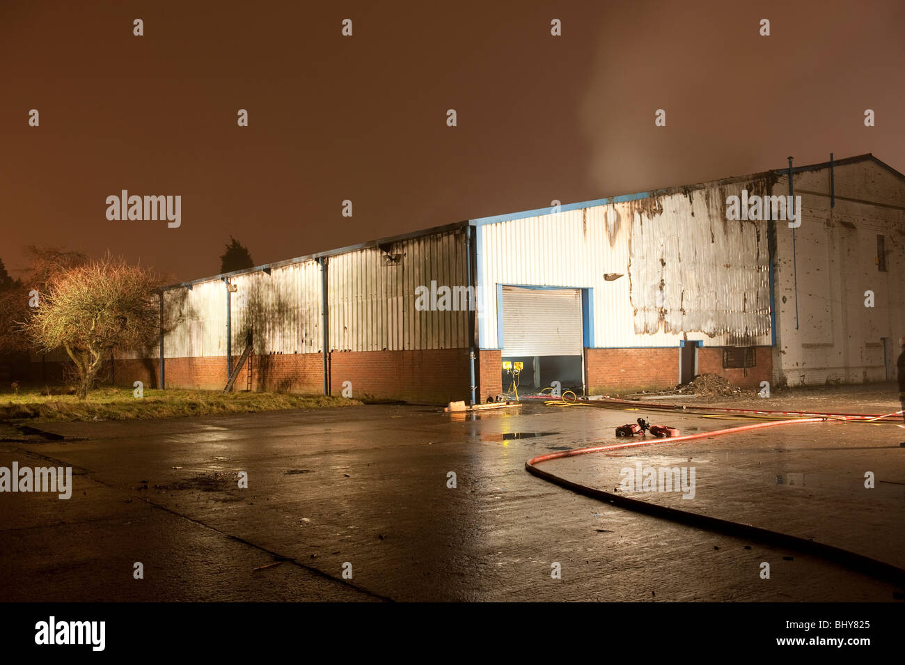 Smouldering warehouse factory after major fire Stock Photo - Alamy