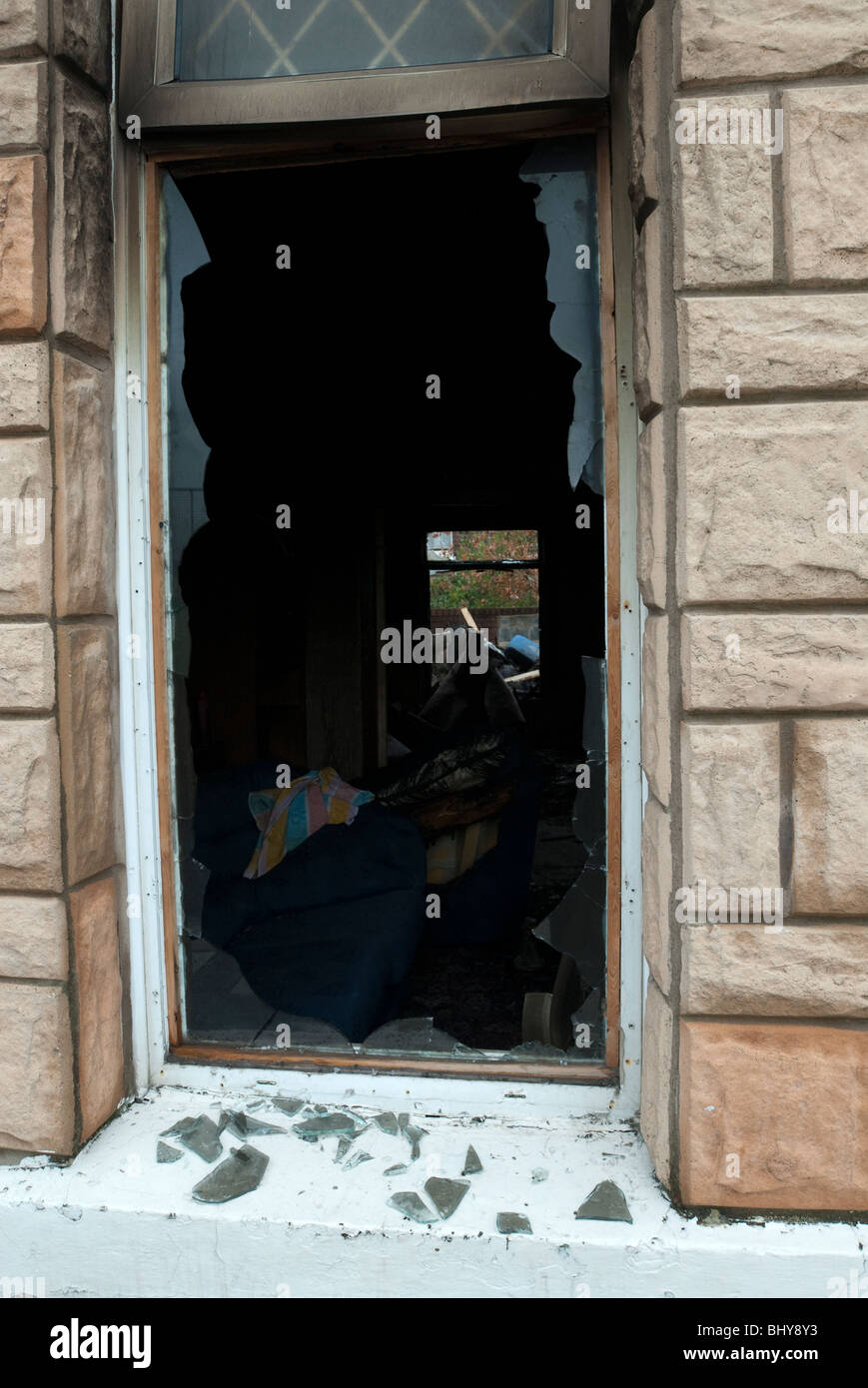 Smashed window of lounge following domestic fire Stock Photo - Alamy