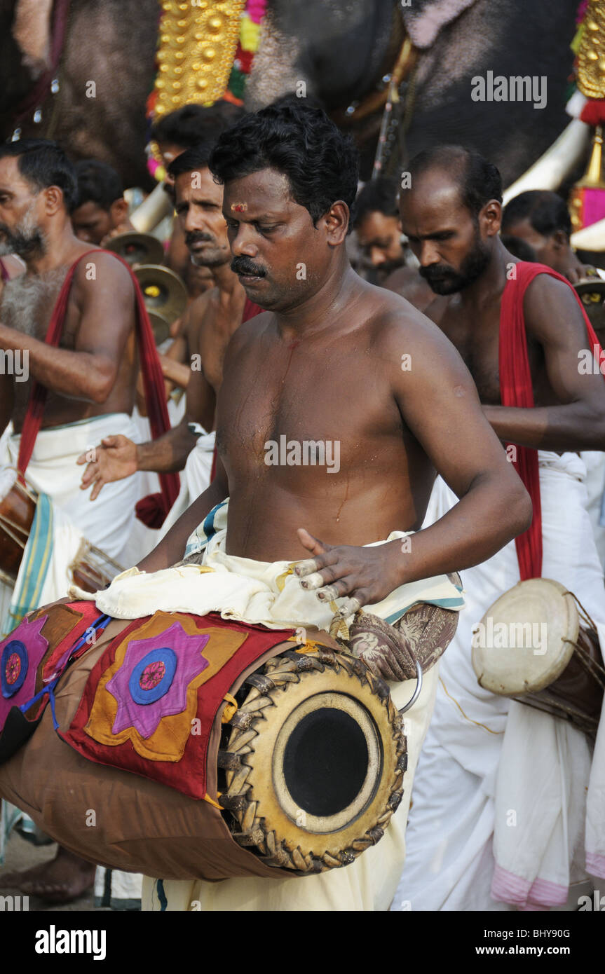 Indian drummer taking part in parade during Hindu temple festival in ...