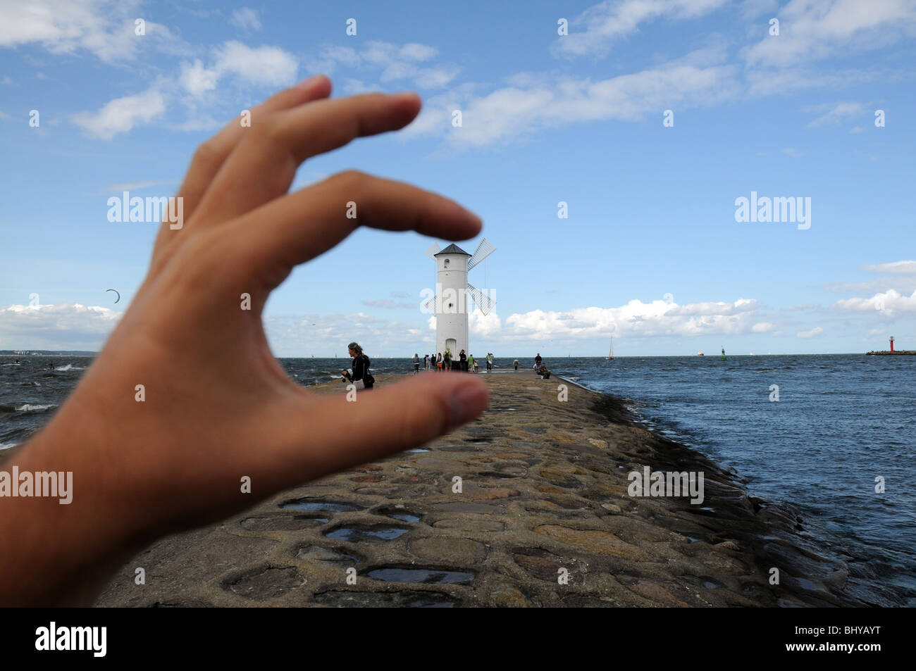 Beacon "Windmill" on stone pier next to port entry in Swinoujscie at ...