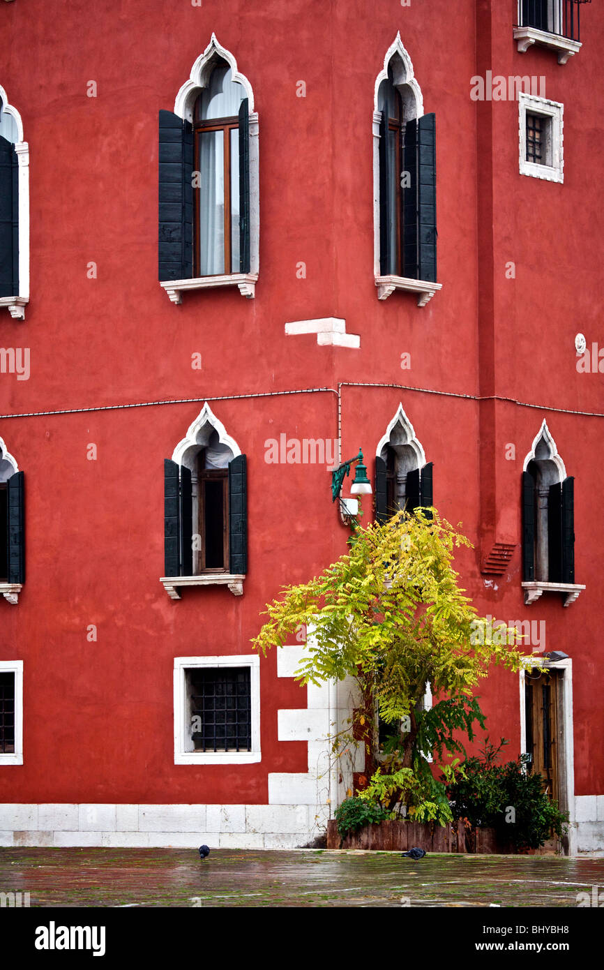 A red house frontage in a square in Venice, Veneto, Italy Stock Photo ...