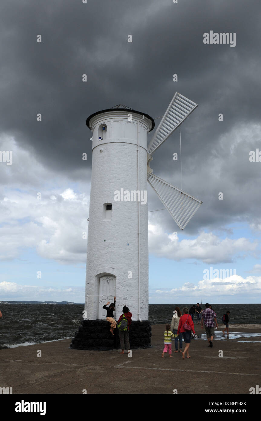 Beacon "Windmill" on stone pier next to port entry in Swinoujscie at ...