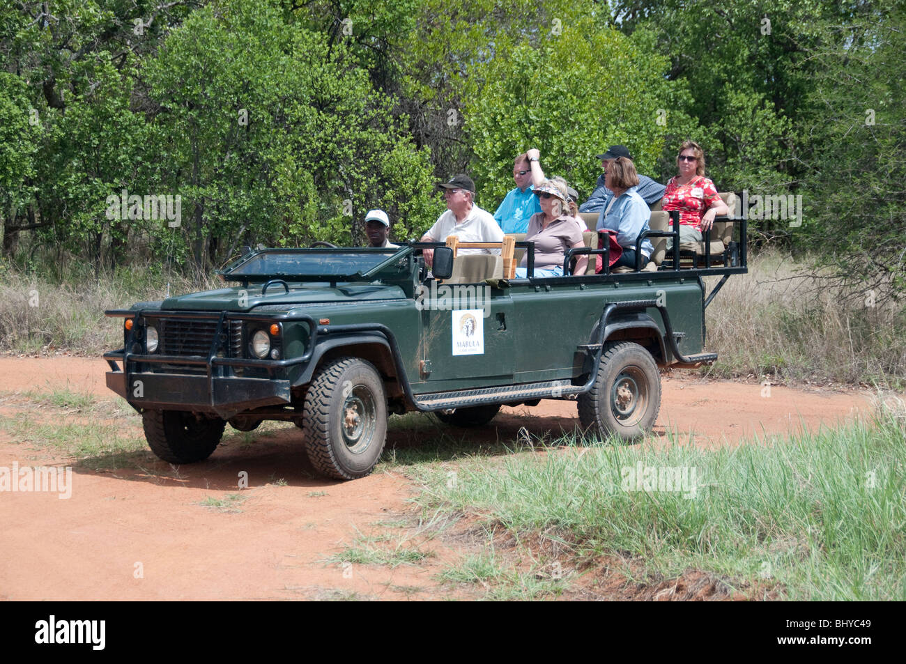 Land Rover with Game Drive Ranger and Tourists Stock Photo - Alamy