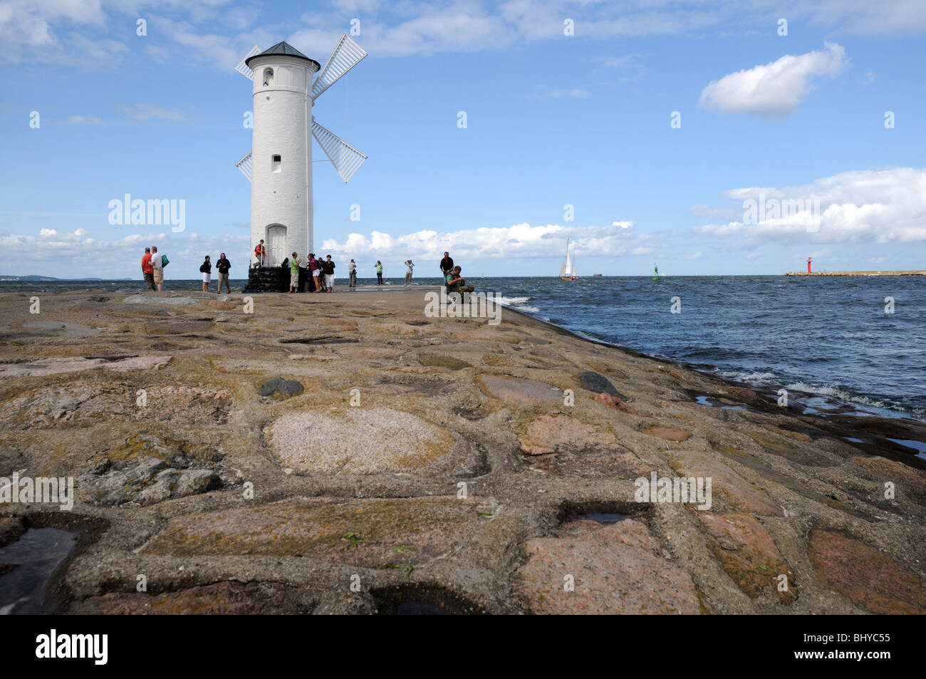 Beacon "Windmill" on stone pier next to port entry in Swinoujscie at ...
