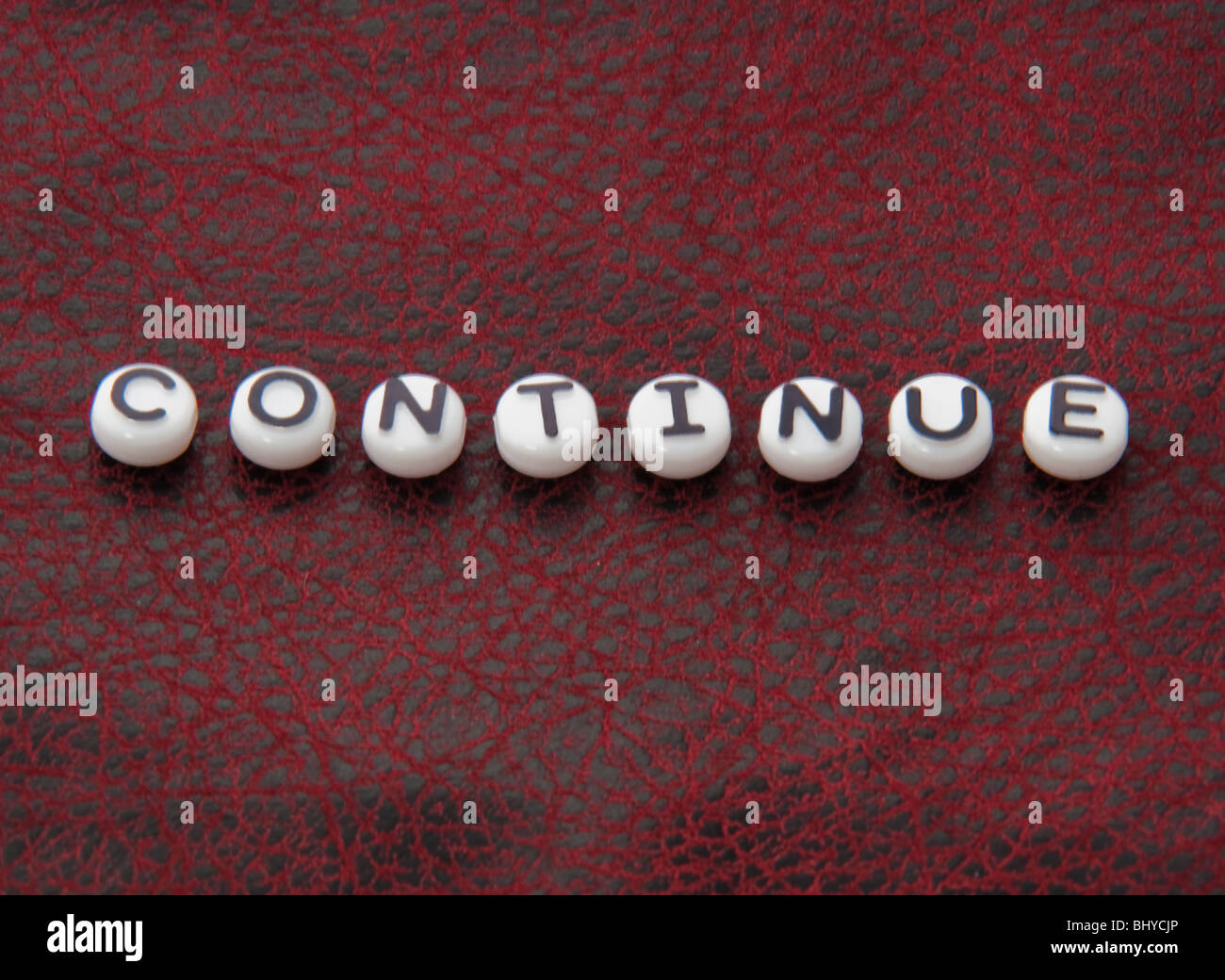 The word continue is part of this series on black and white round ...