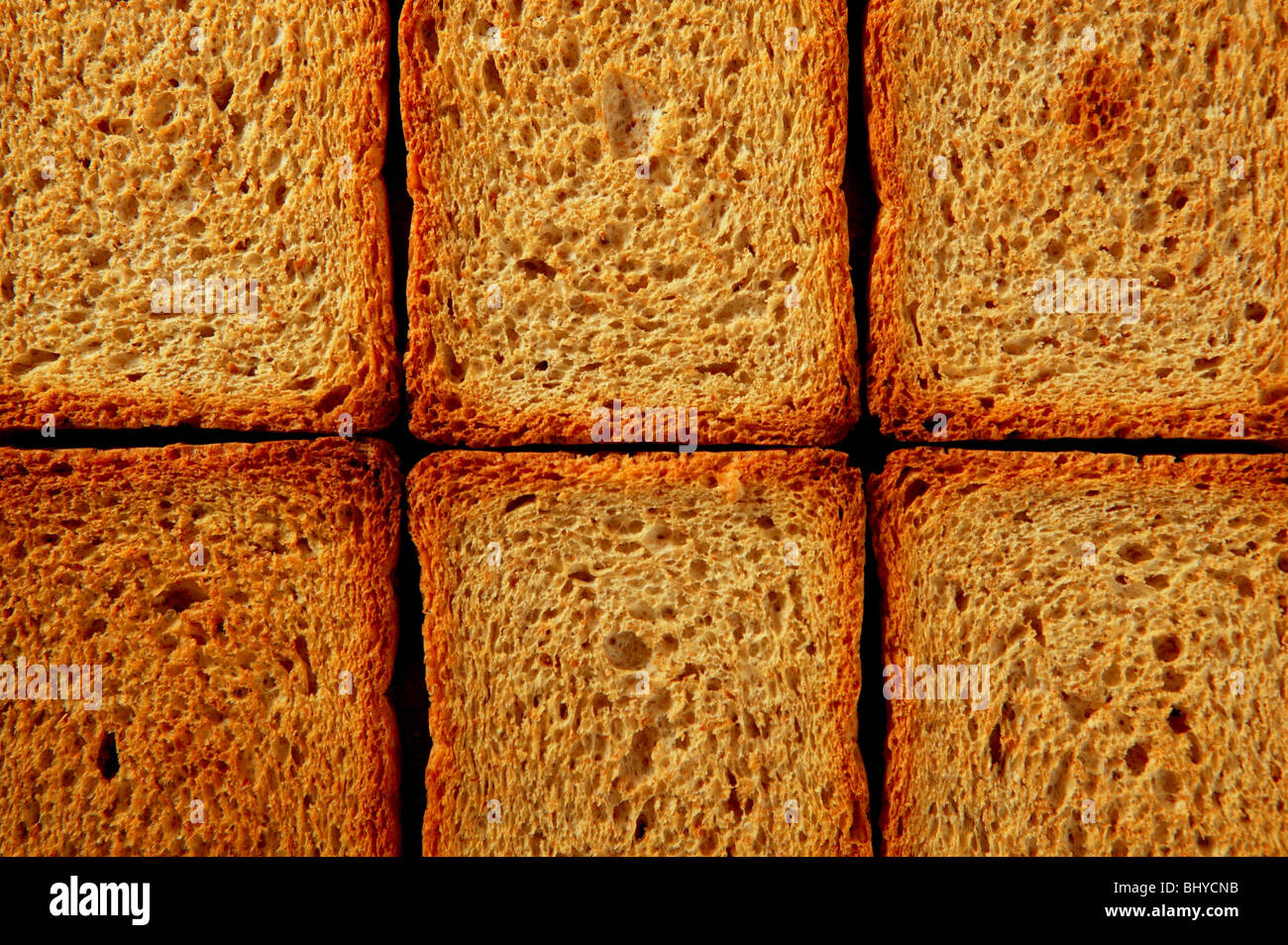 Toasted golden bread slices in rows arrangement Stock Photo - Alamy