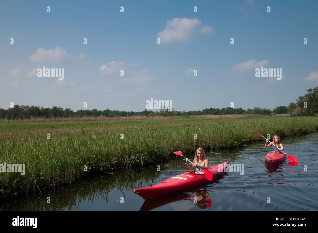 Young girls Kayaking in wilderness and having a lot of fun on a ...
