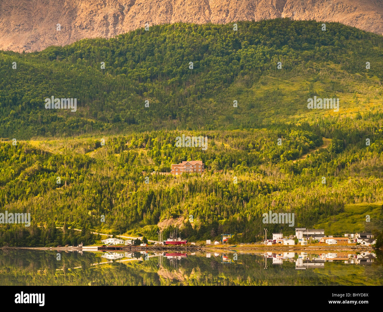 NEWFOUNDLAND, SHOAL BROOK, Bonnie Bay, The Red Mantle Lodge surrounded ...