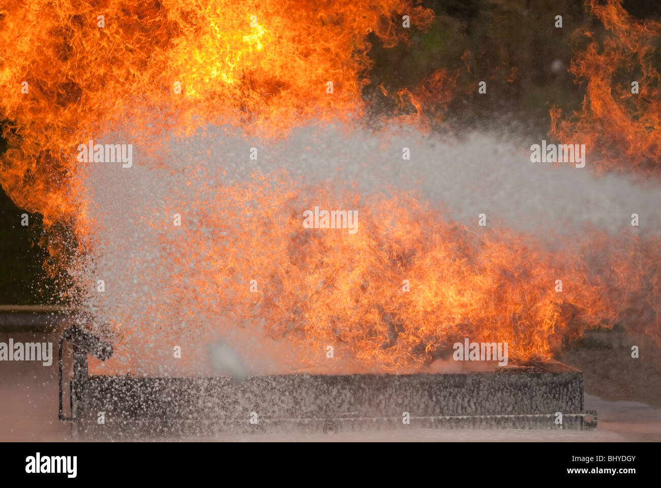 Oil tank fire and flames with foam being applied Stock Photo - Alamy