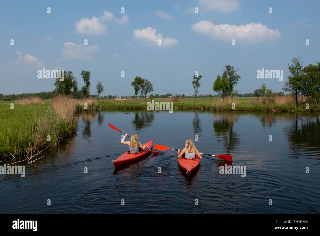 Young girls Kayaking in wilderness and having a lot of fun on a ...