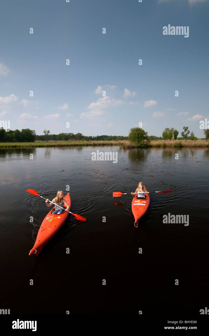 Young girls Kayaking in wilderness and having a lot of fun on a ...