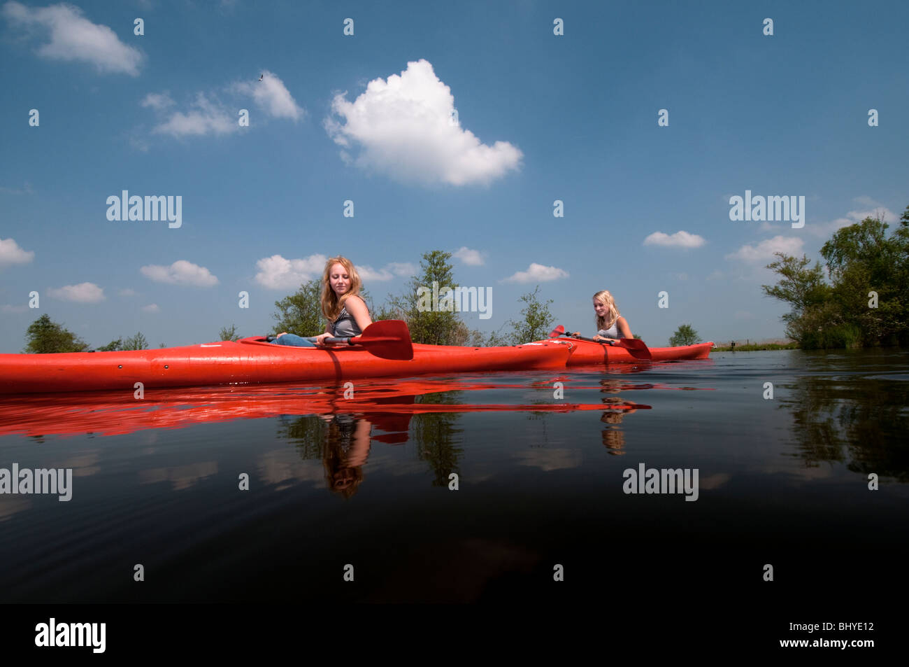 Young girls Kayaking in wilderness and having a lot of fun on a ...