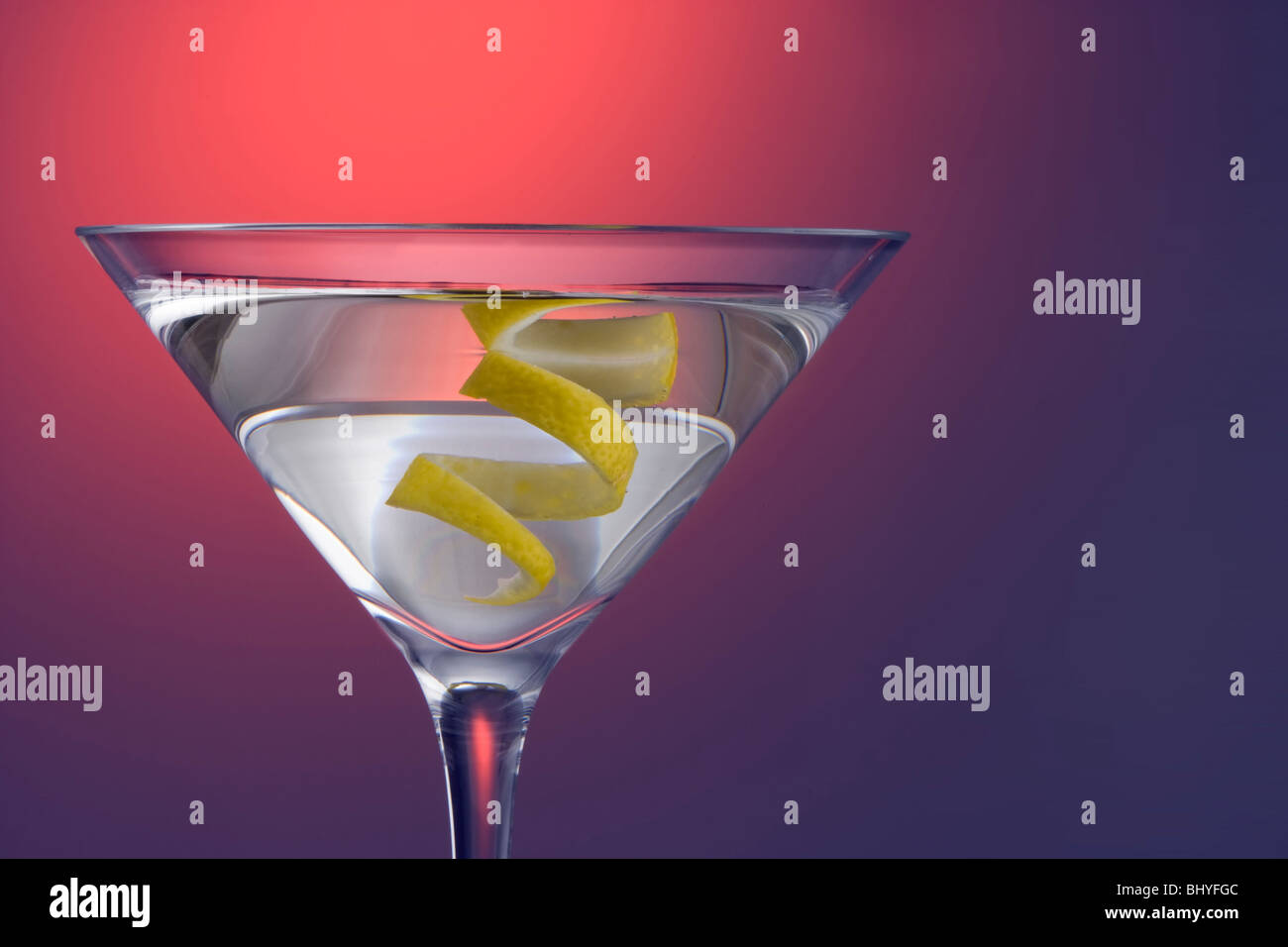 Spotlighted Straight up Martini with Lemon Twist Garnish on Colorful ...