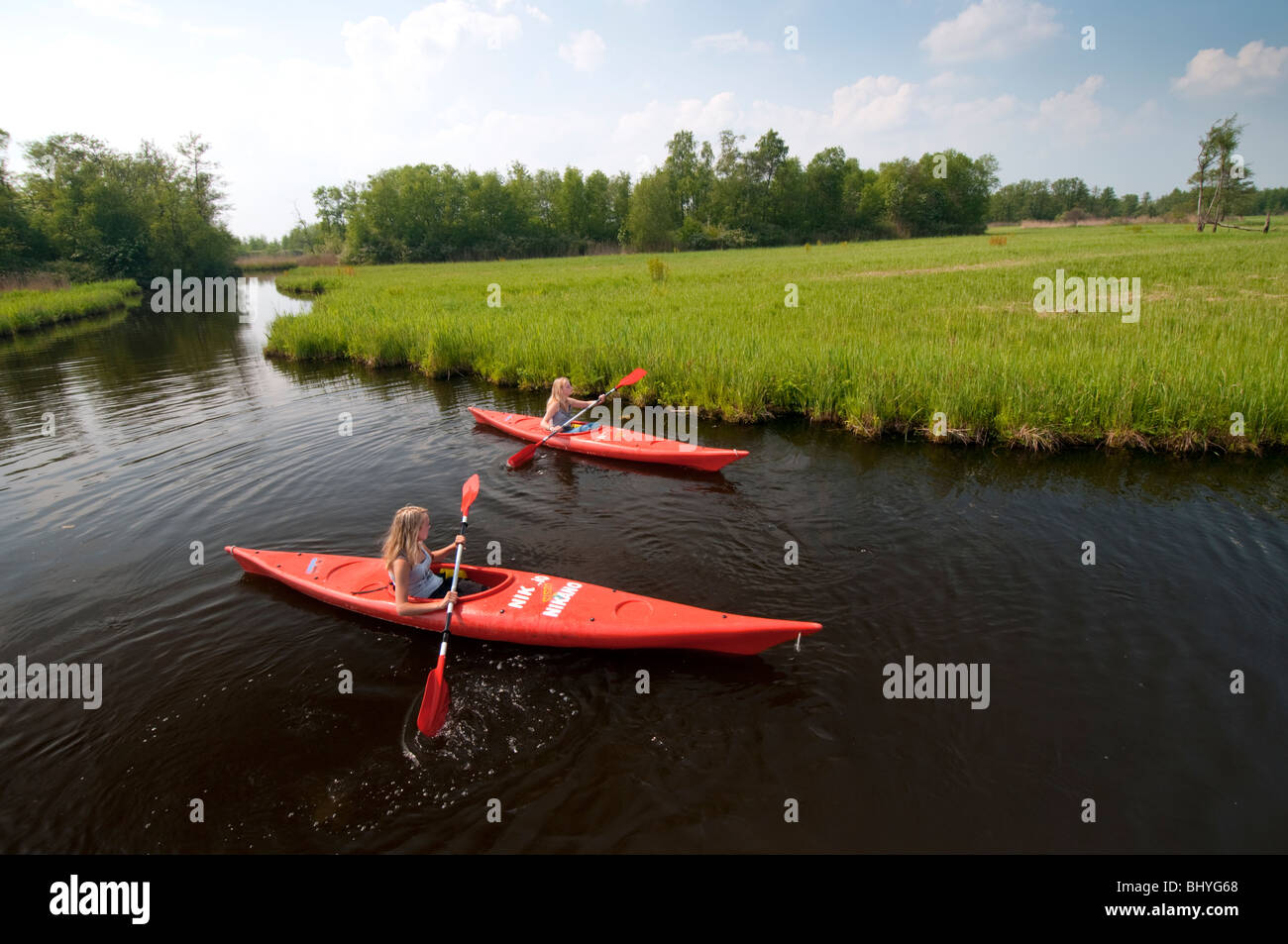 Young girls Kayaking in wilderness and having a lot of fun on a ...