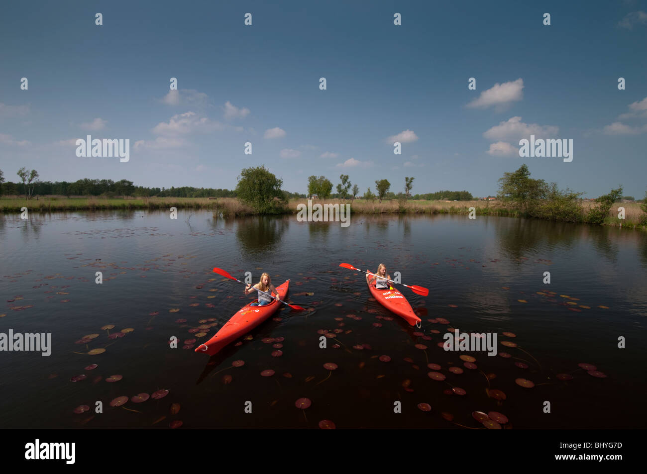 Young girls Kayaking in wilderness and having a lot of fun on a ...