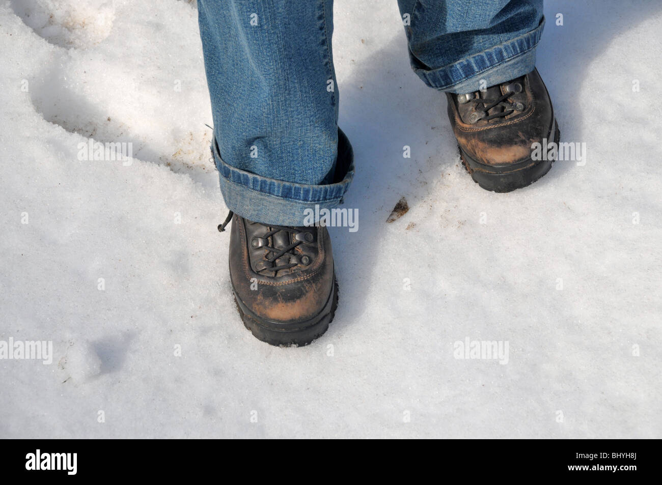Person with boots on, standing / walking in snow Stock Photo - Alamy