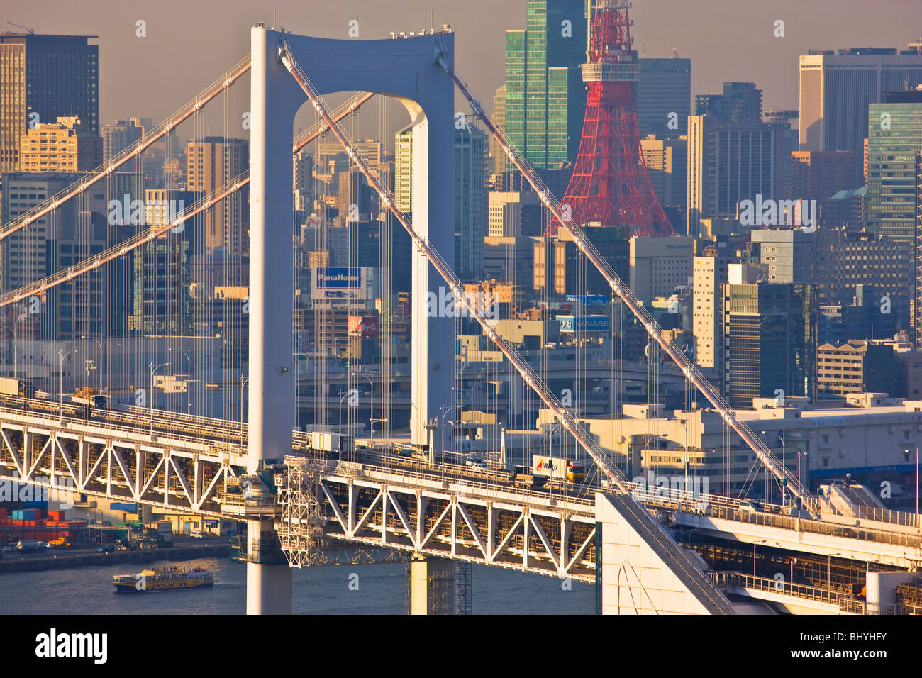 A Tokyo Bay ferry passes under Rainbow Bridge, which crosses Tokyo Bay ...