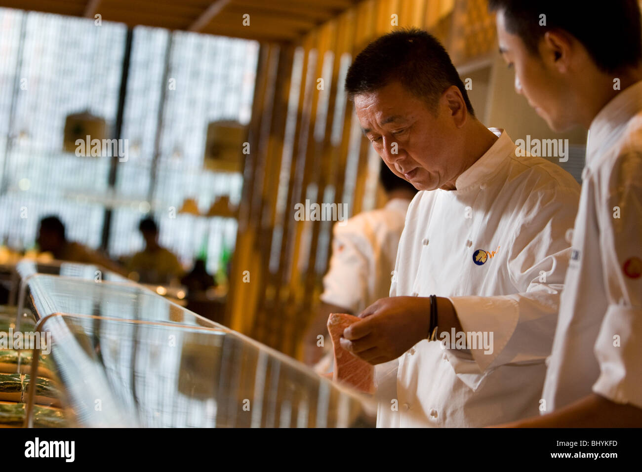 Chef and owner of 'Nobu' restaurants, Nobuyuki Matsuhisa (2nd from ...