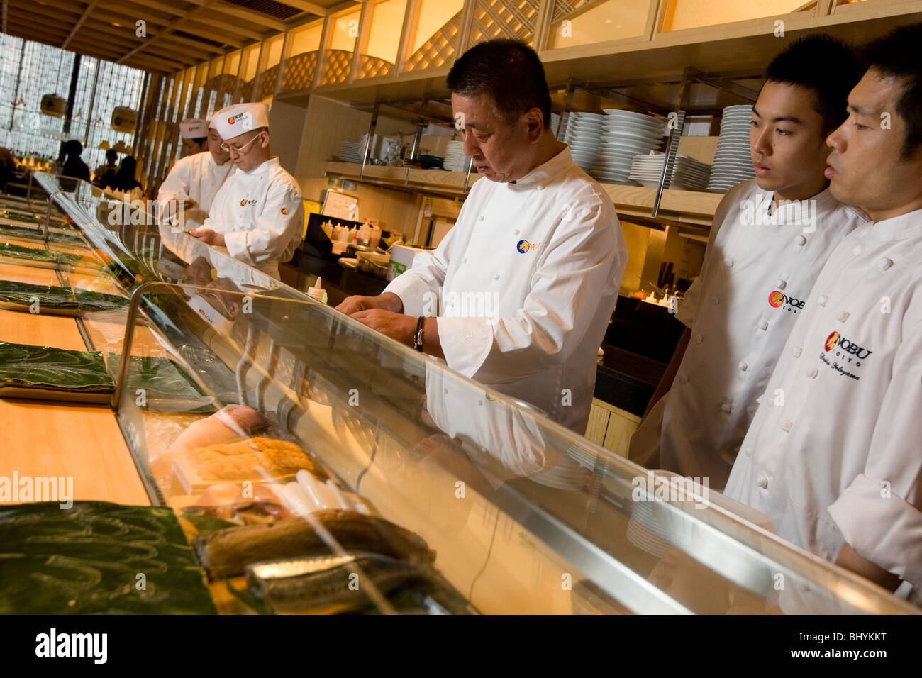 Chef and owner of 'Nobu' restaurants, Nobuyuki Matsuhisa (centre of ...
