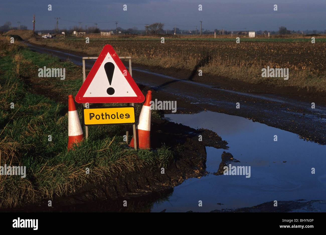 sign warning drivers of potholes on country road yorkshire uk Stock ...