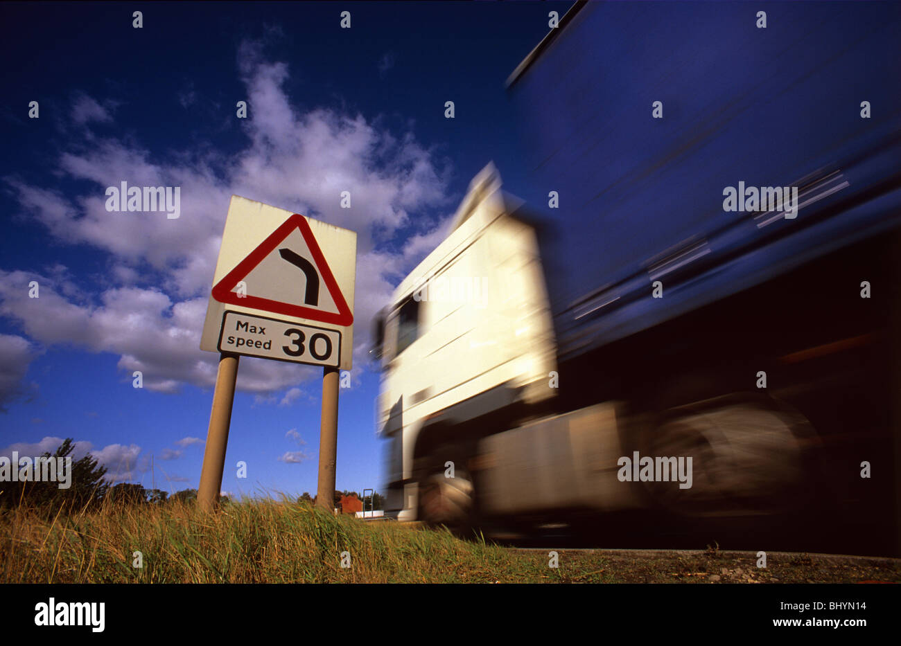 lorry passing warning sign of 30 mph speed limit and sharp left hand ...