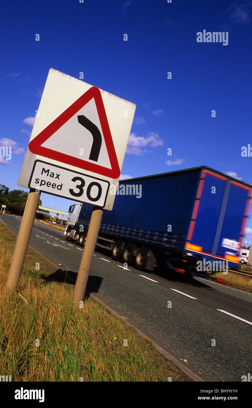 lorry passing warning sign of 30 mph speed limit and sharp left hand ...