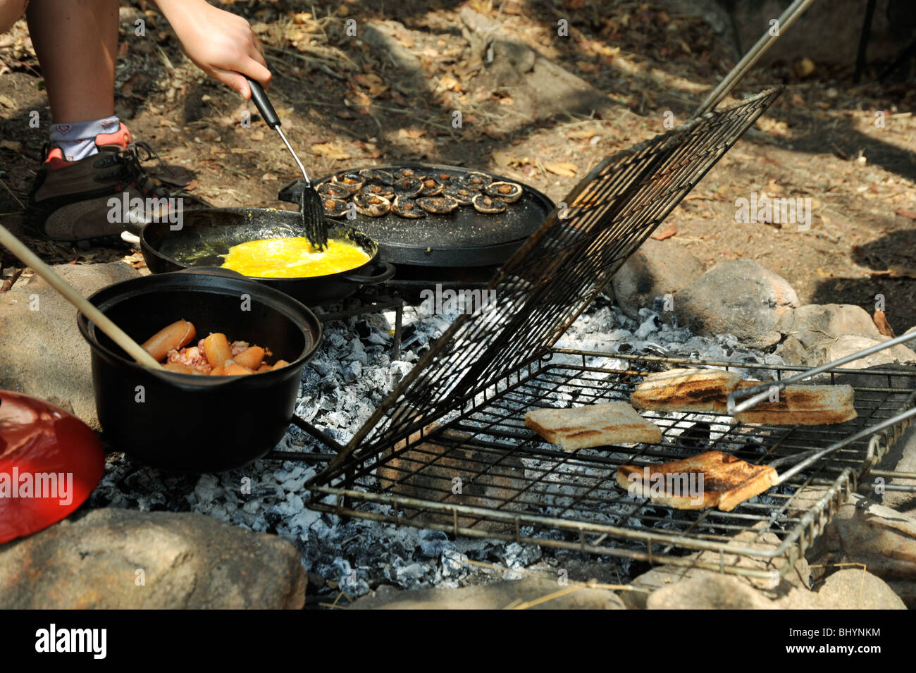 South Africa, food, people cooking breakfast on an open fire during a ...