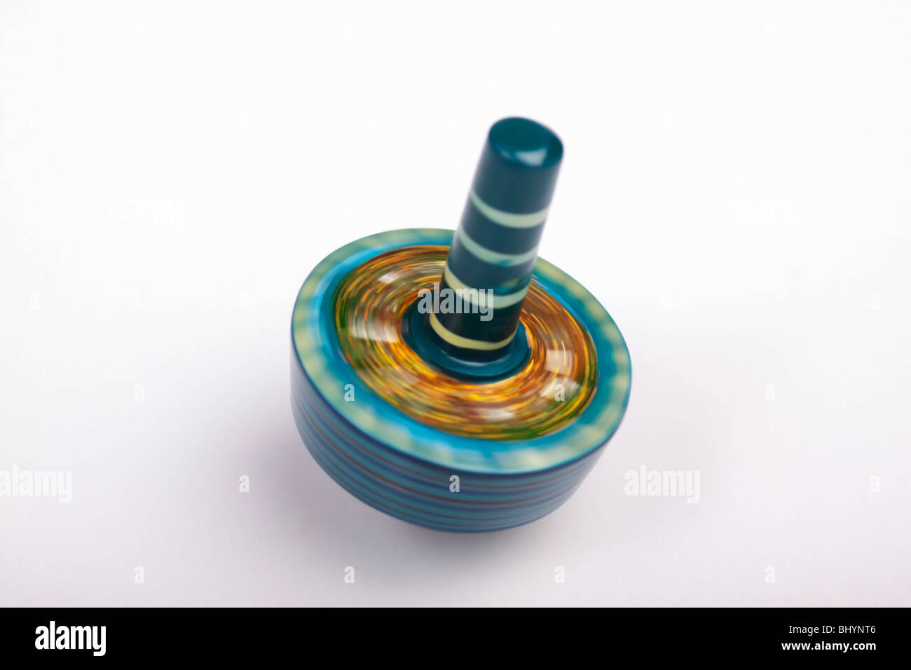 Colourful, spinning top. Isolated. Copy space Stock Photo - Alamy