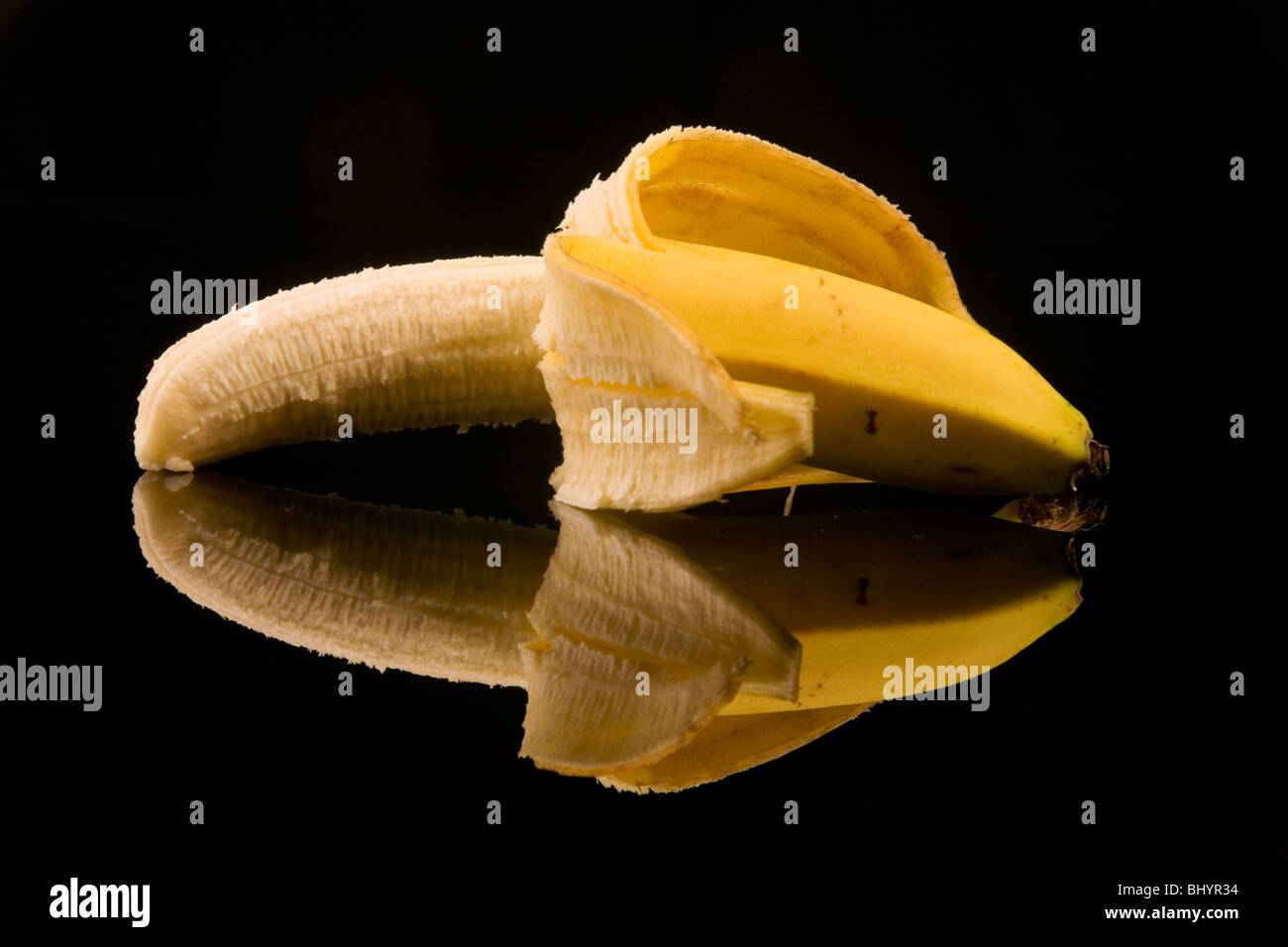 bite off banana Stock Photo - Alamy