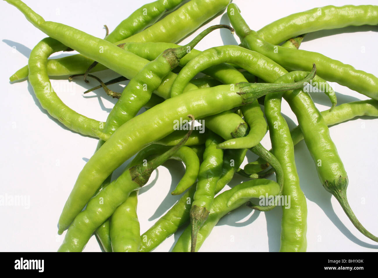 Green chillies isolated Stock Photo - Alamy