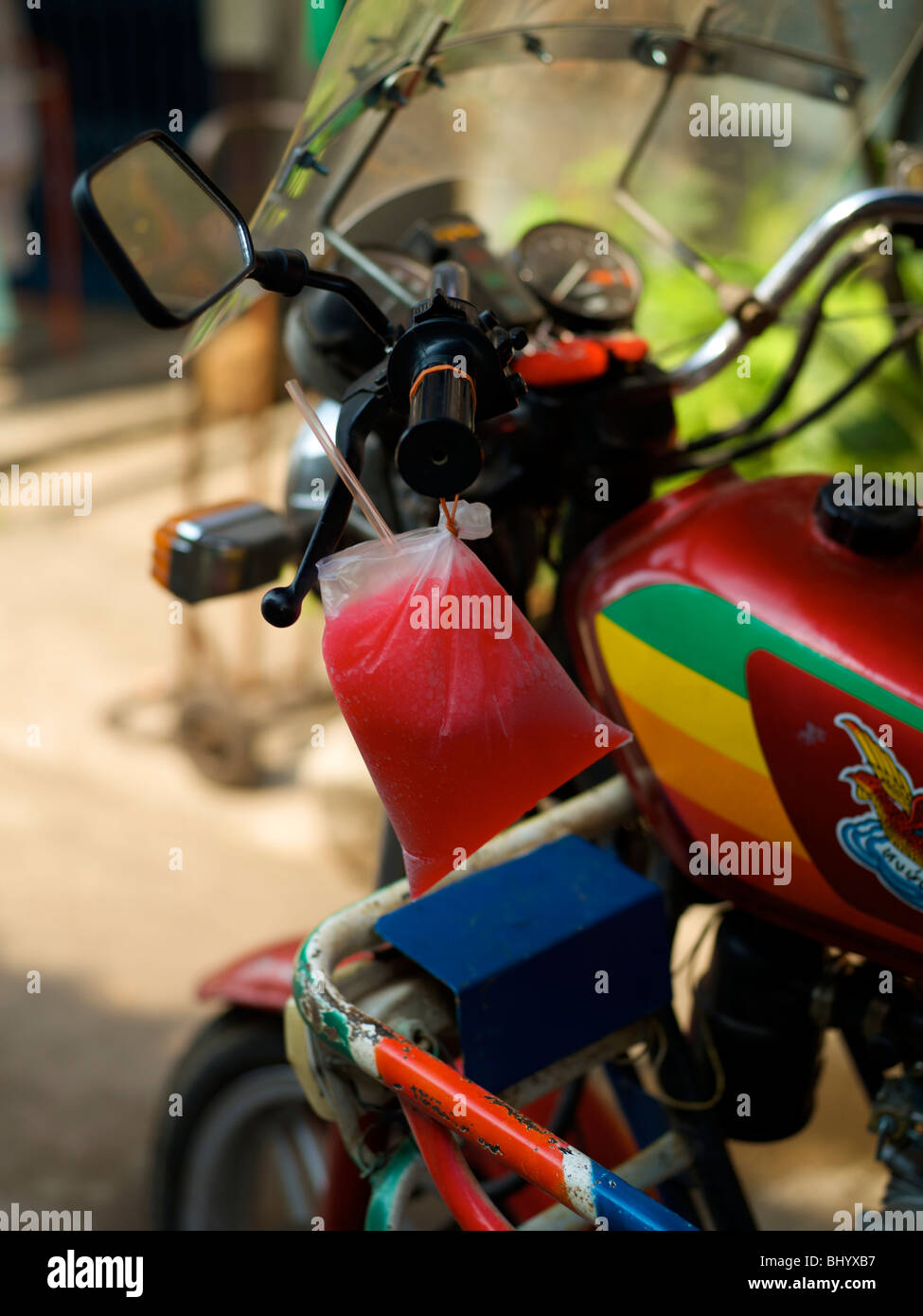 Motorbike with a strawberry flavored bag drink on the handlebar Stock ...