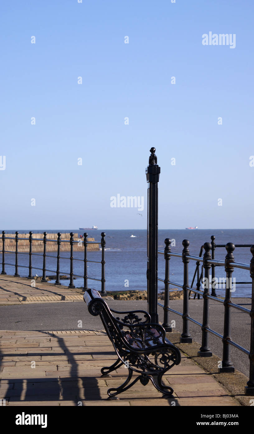 Hartlepool Headland promenade with wrought iron seat and the Heugh ...