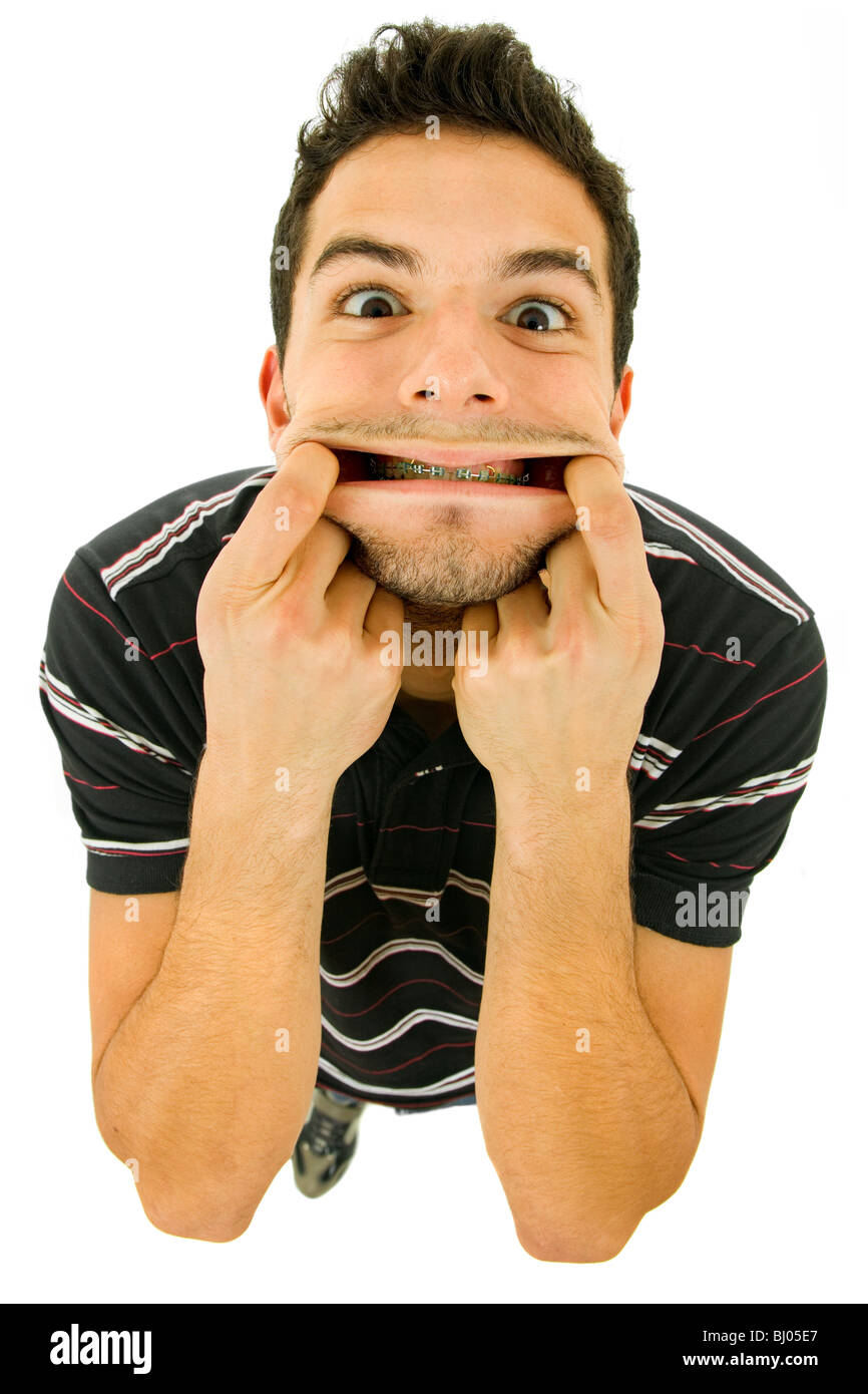 young casual silly man portrait in a white background Stock Photo - Alamy