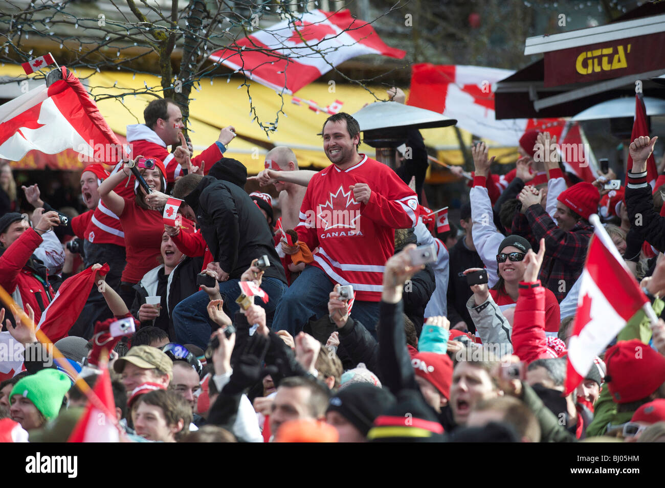 Crowd of fans waving flags hi-res stock photography and images - Alamy