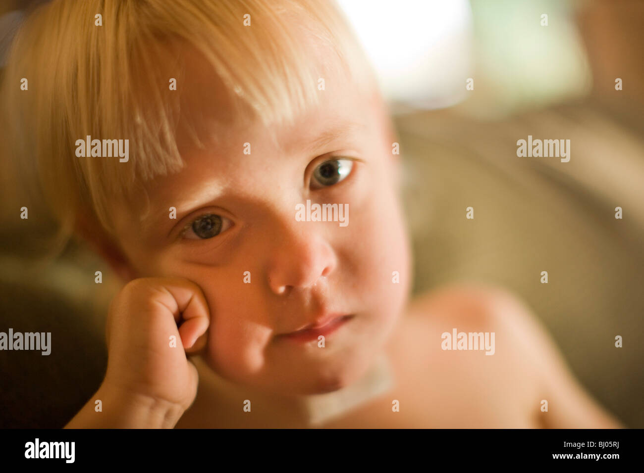 Young boy with serious expression Stock Photo - Alamy