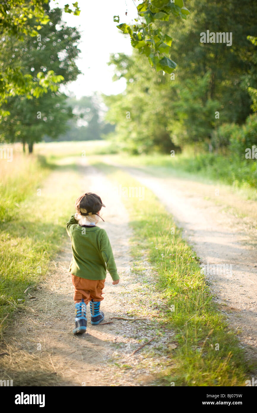 Boy walking country road alone High Resolution Stock Photography and ...
