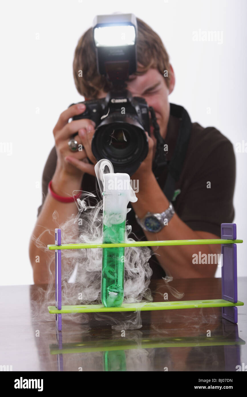 Student taking a picture of a test tube Stock Photo - Alamy