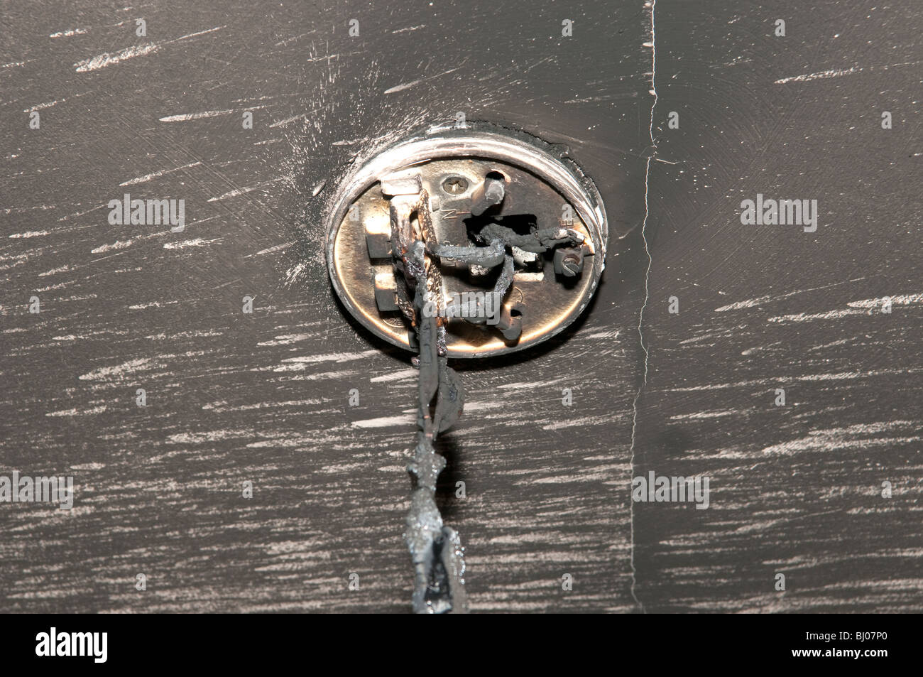 Melted light ceiling rose following house fire Stock Photo - Alamy