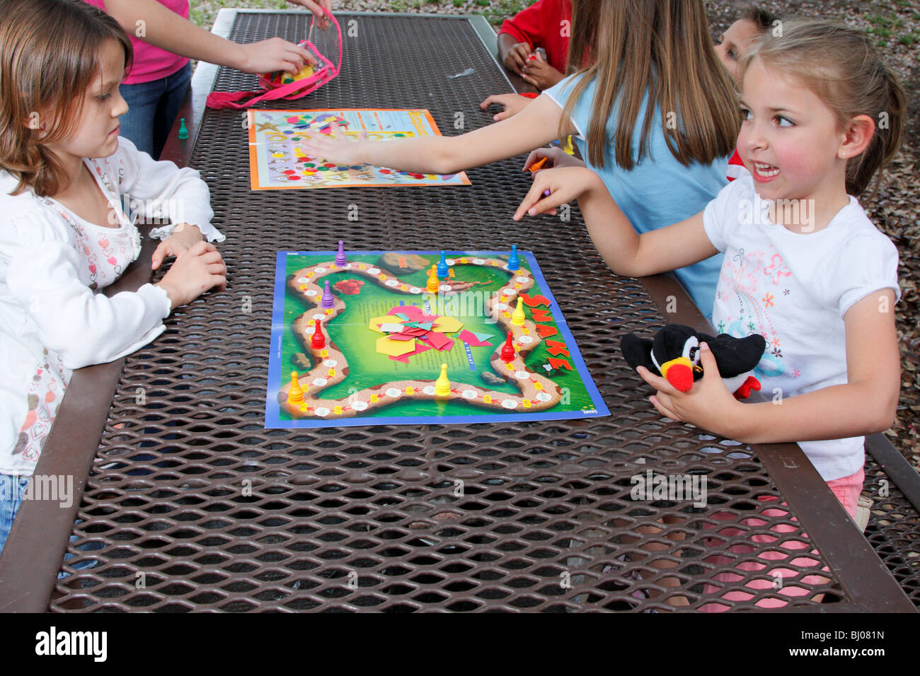 Kids playing a board game Stock Photo - Alamy
