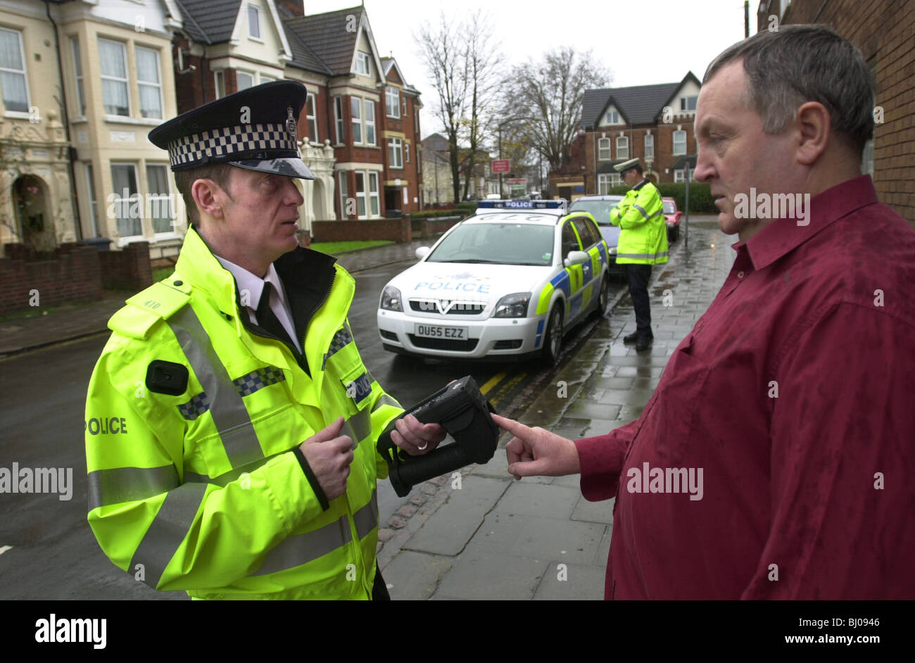 Police use an electronic machine that reads and analyses finger prints ...